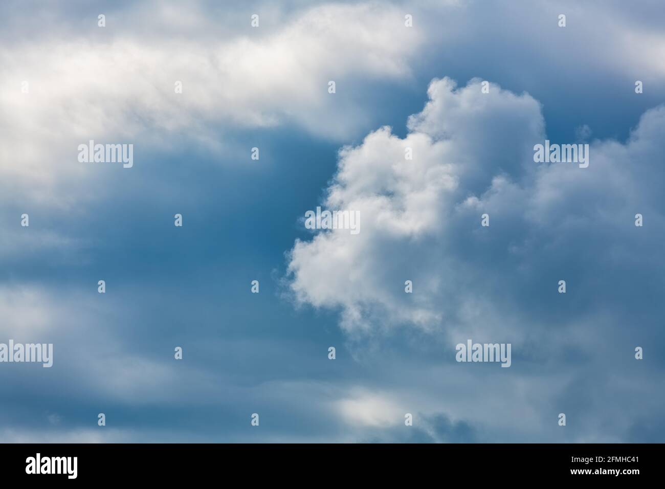 Bright White Clouds In A Blue Twilight Sky Stock Photo - Alamy