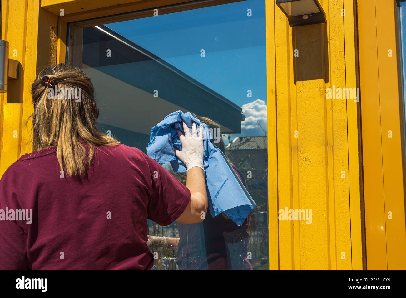 Cleaning girl standing glass cleaner hi-res stock photography and ...