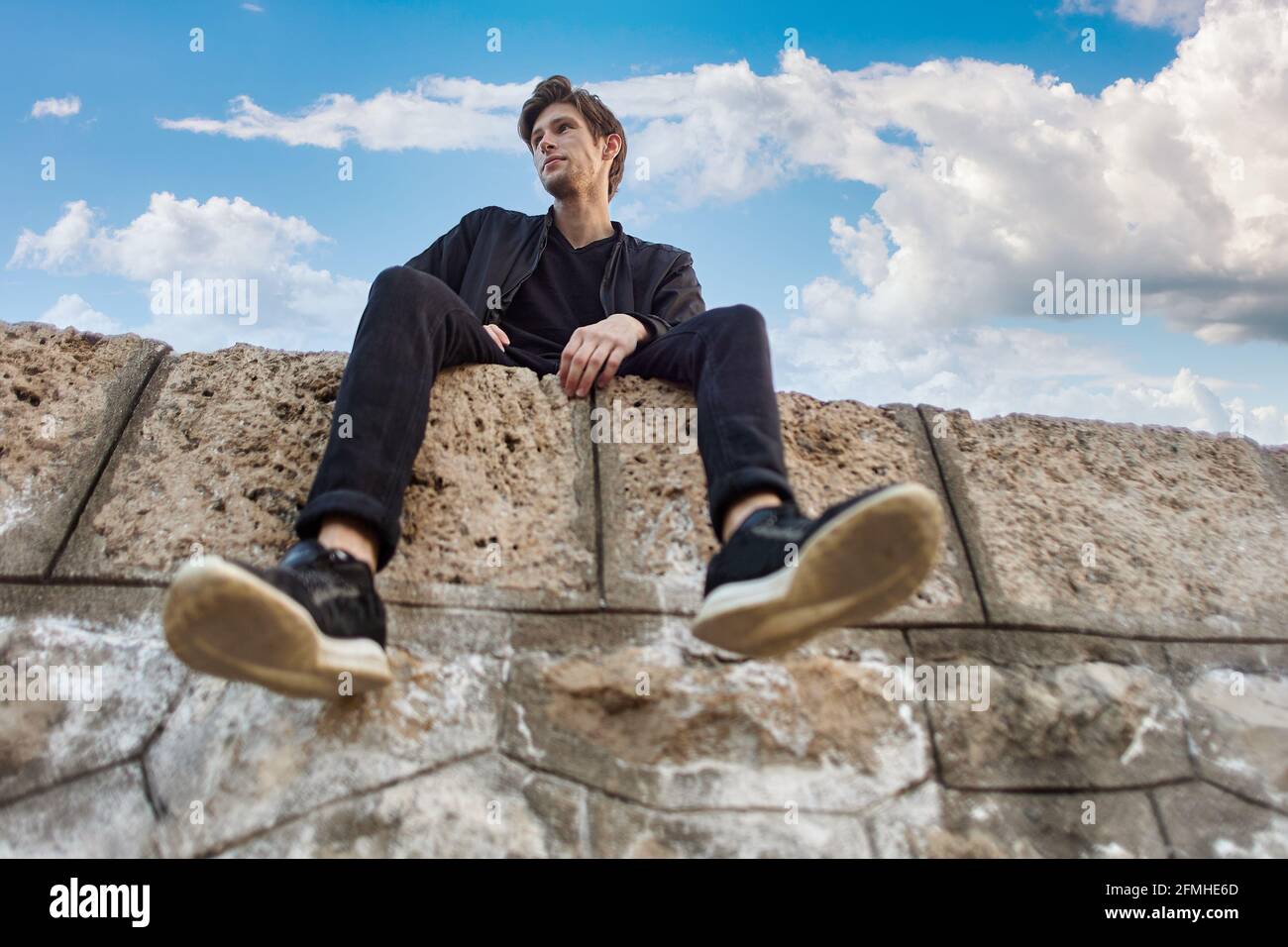 Skinny man sitting hi-res stock photography and images - Alamy