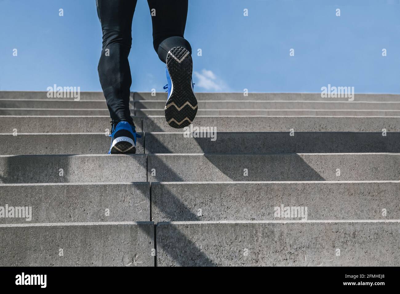 The action of young man feet climbing stairs outdoors Stock Photo - Alamy
