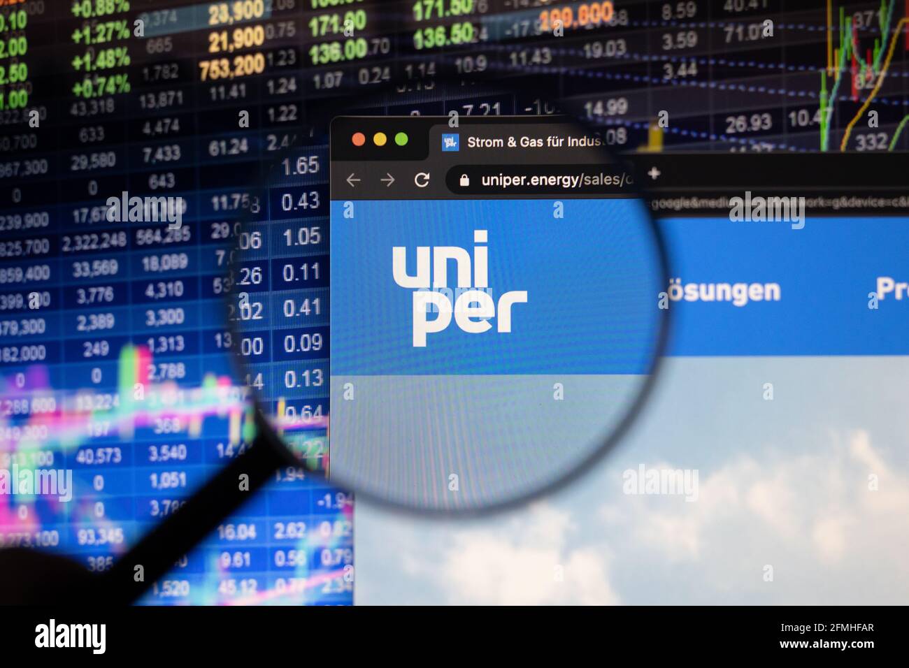 Uniper company logo on a website with blurry stock market developments in the background, seen ...
