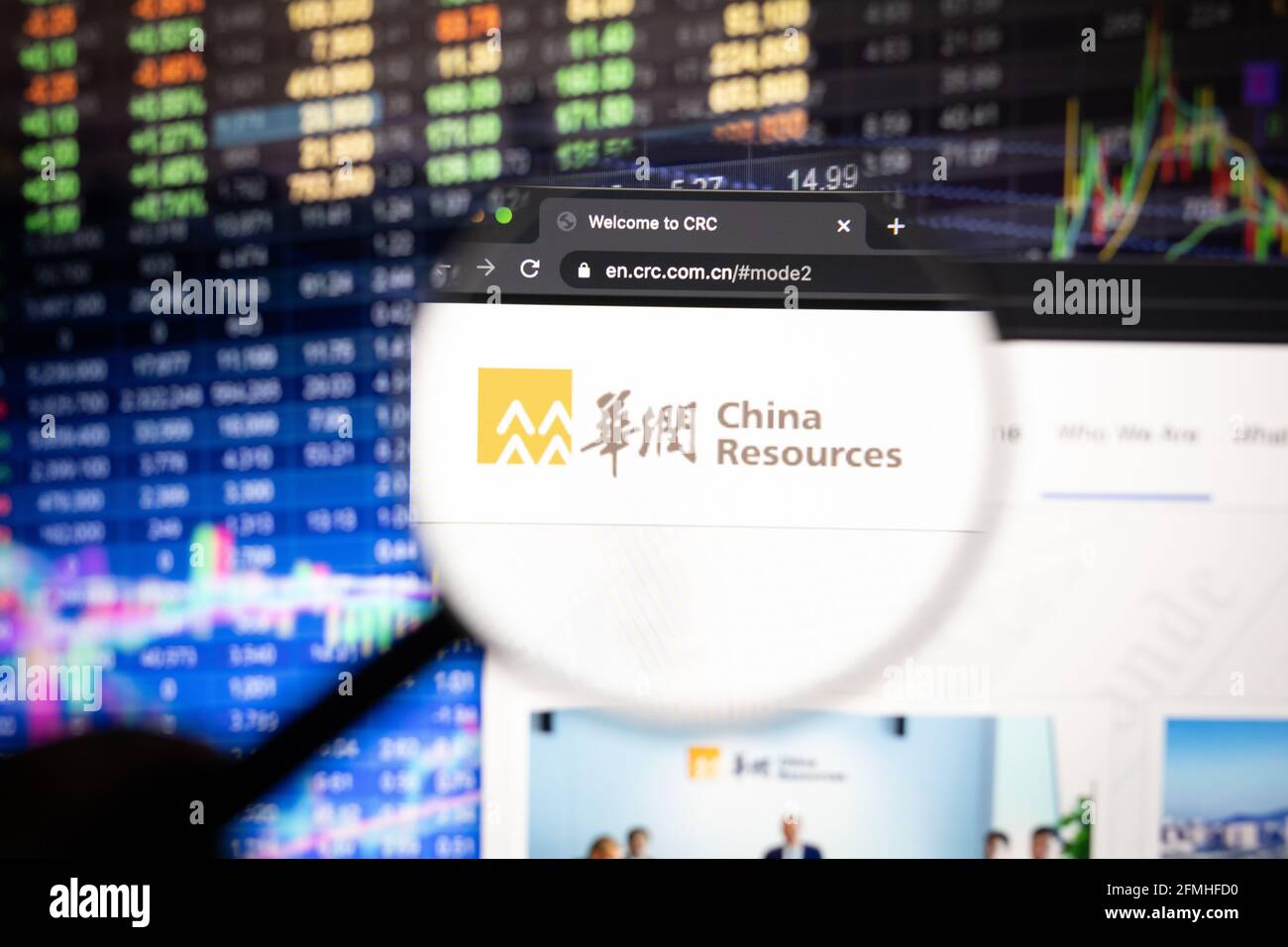 China Resources company logo on a website with blurry stock market developments in the ...