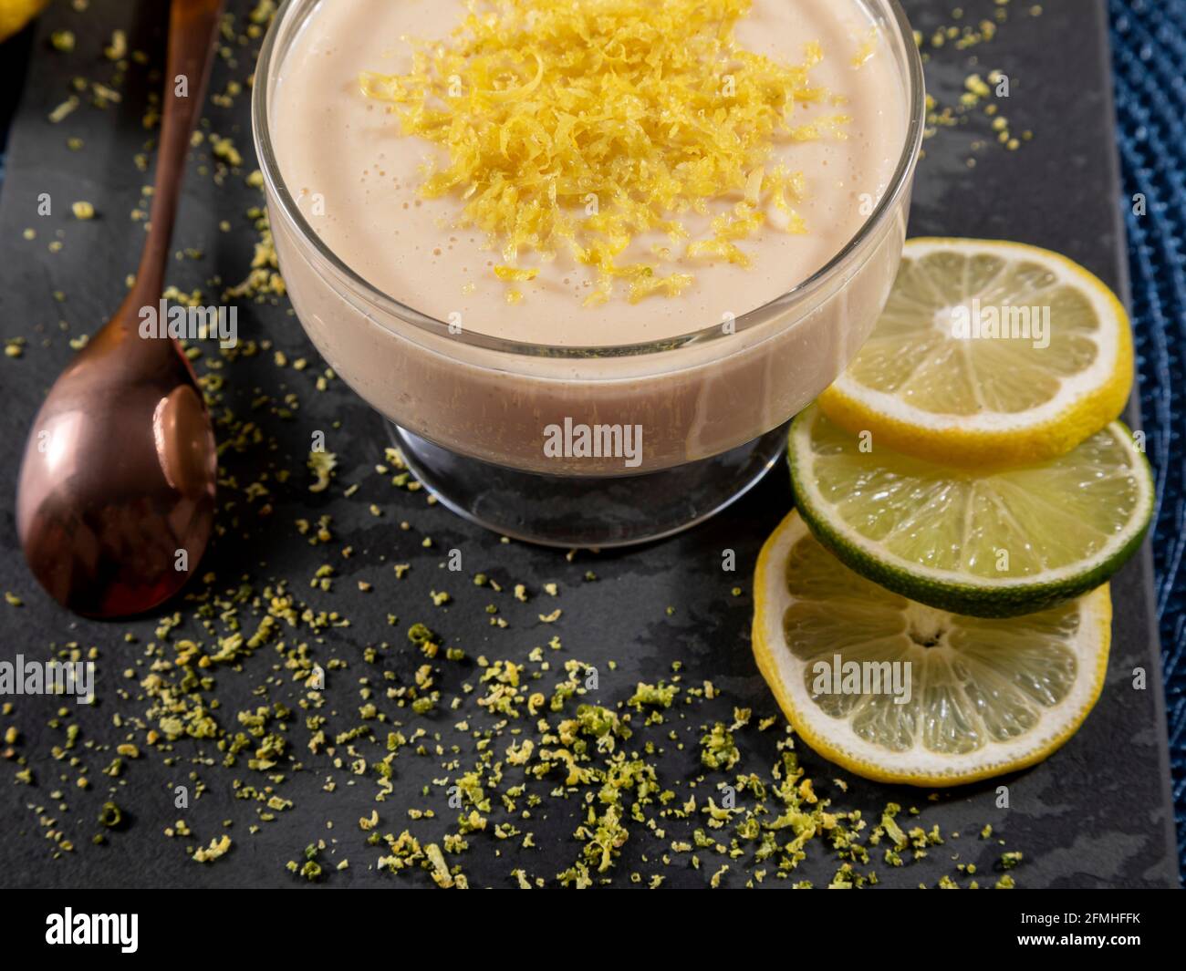Lemon mousse in crystal bowl with lemon zest Stock Photo - Alamy