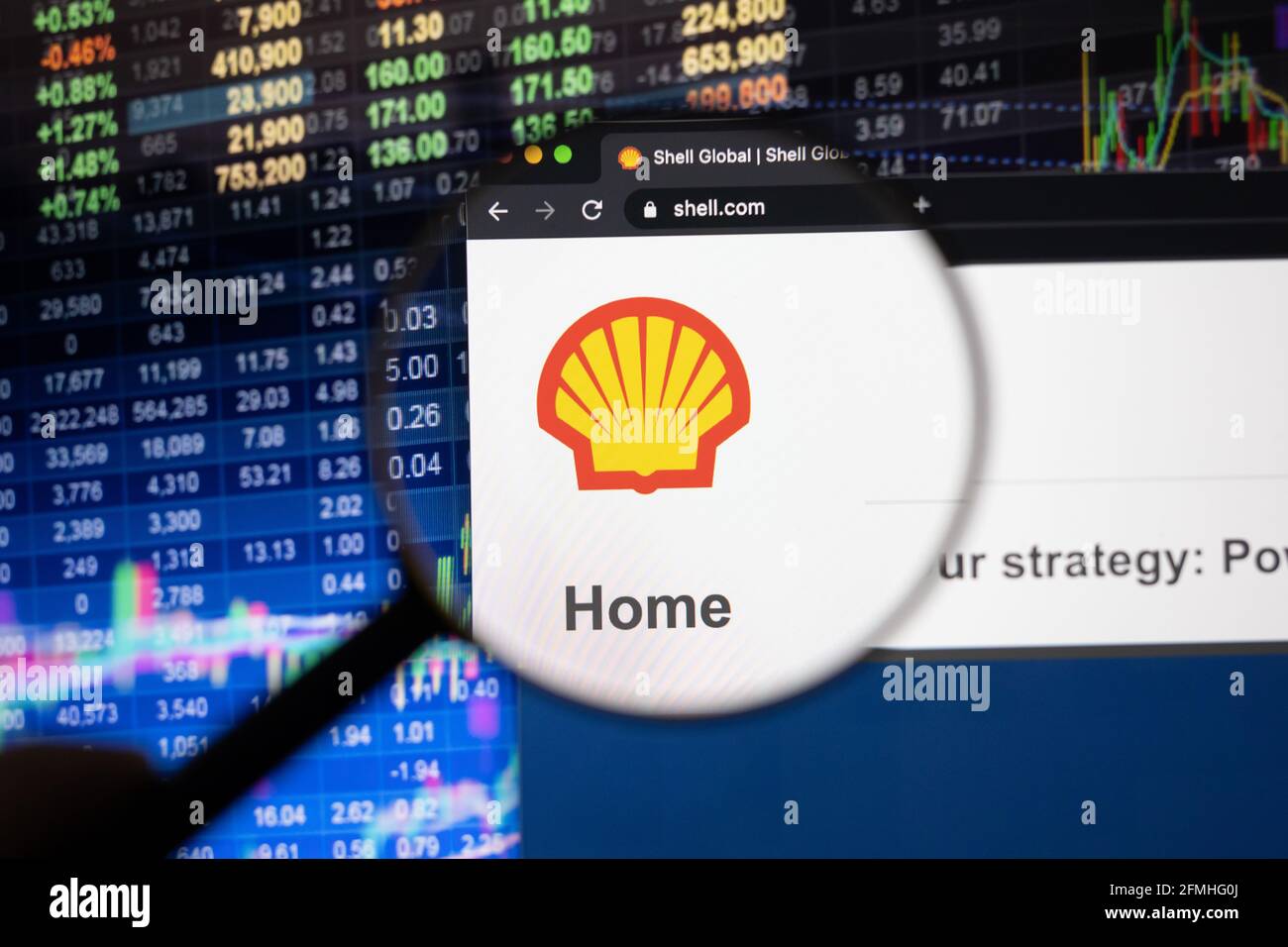 Royal Dutch Shell company logo on a website with blurry stock market ...