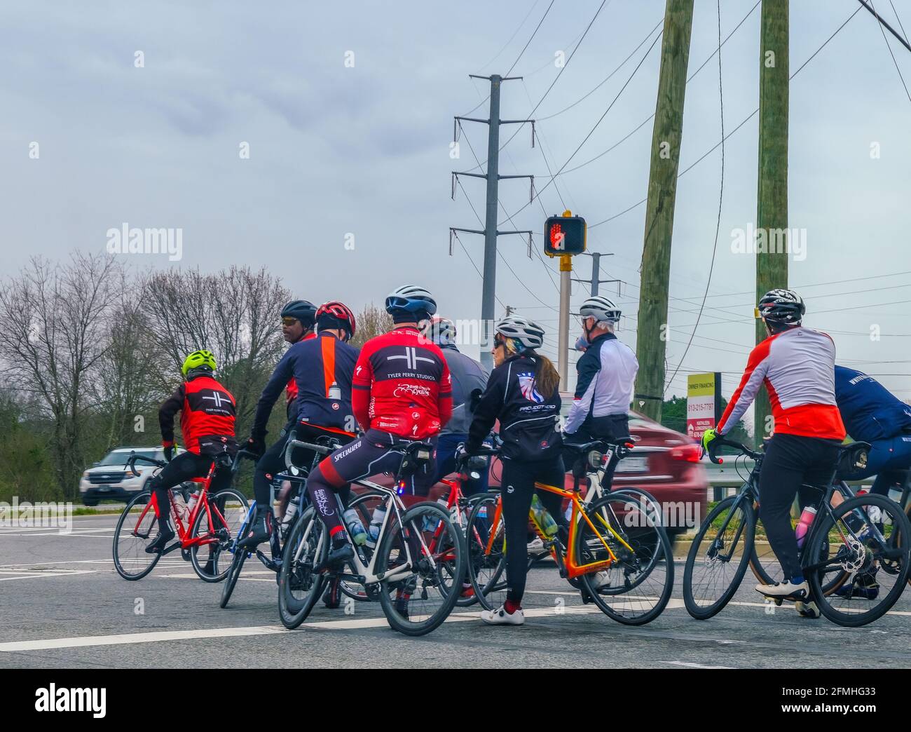 Group of Cyclists at a Red LIght Stock Photo - Alamy