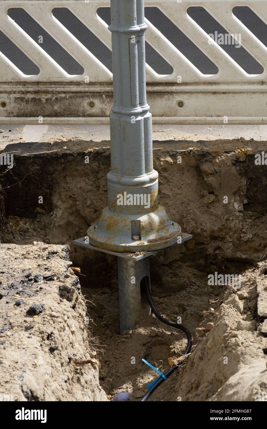 A repairing process of a street lights wires, the dug bottom of a metal ...