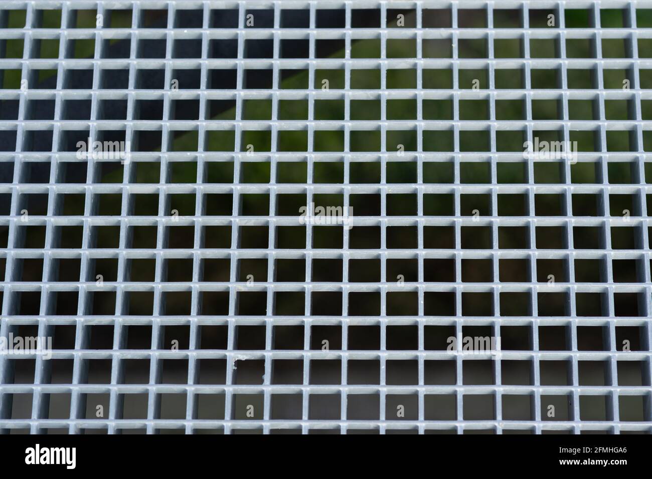 A horizontal background of a gray metal mesh with square holes Stock ...
