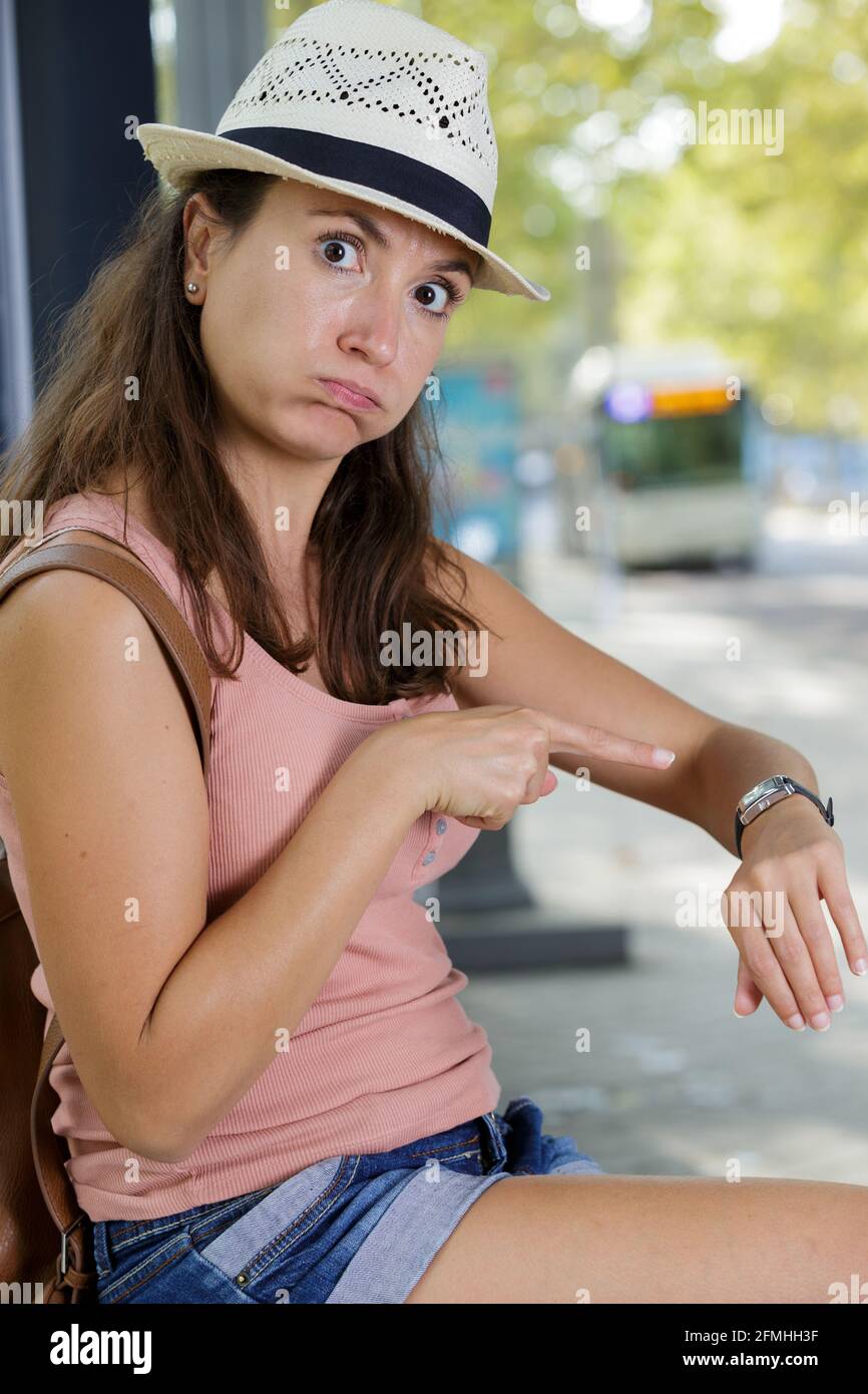 Woman waiting for bus unhappy hi-res stock photography and images - Alamy