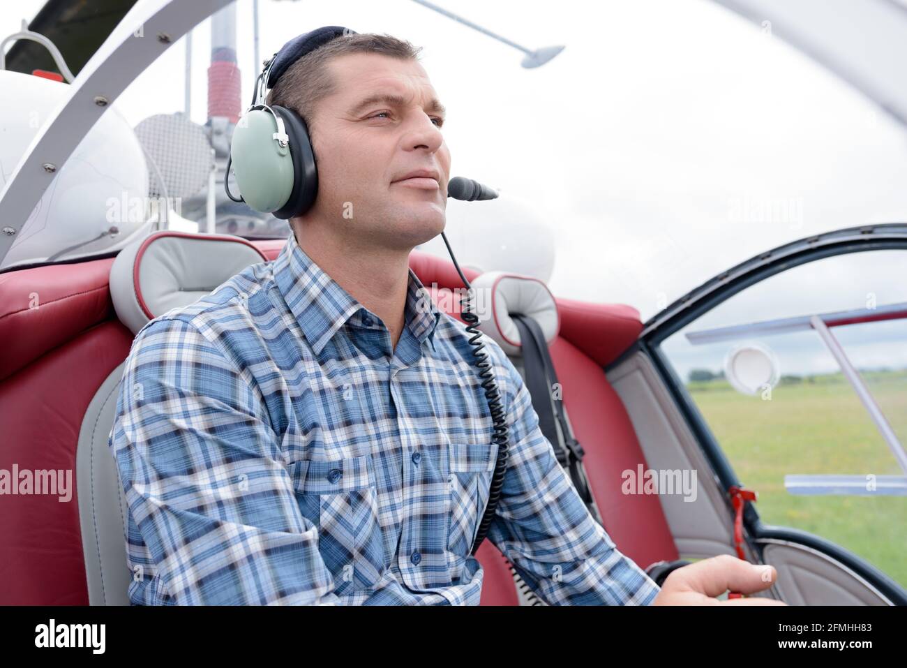 a man is inside helicopter Stock Photo - Alamy