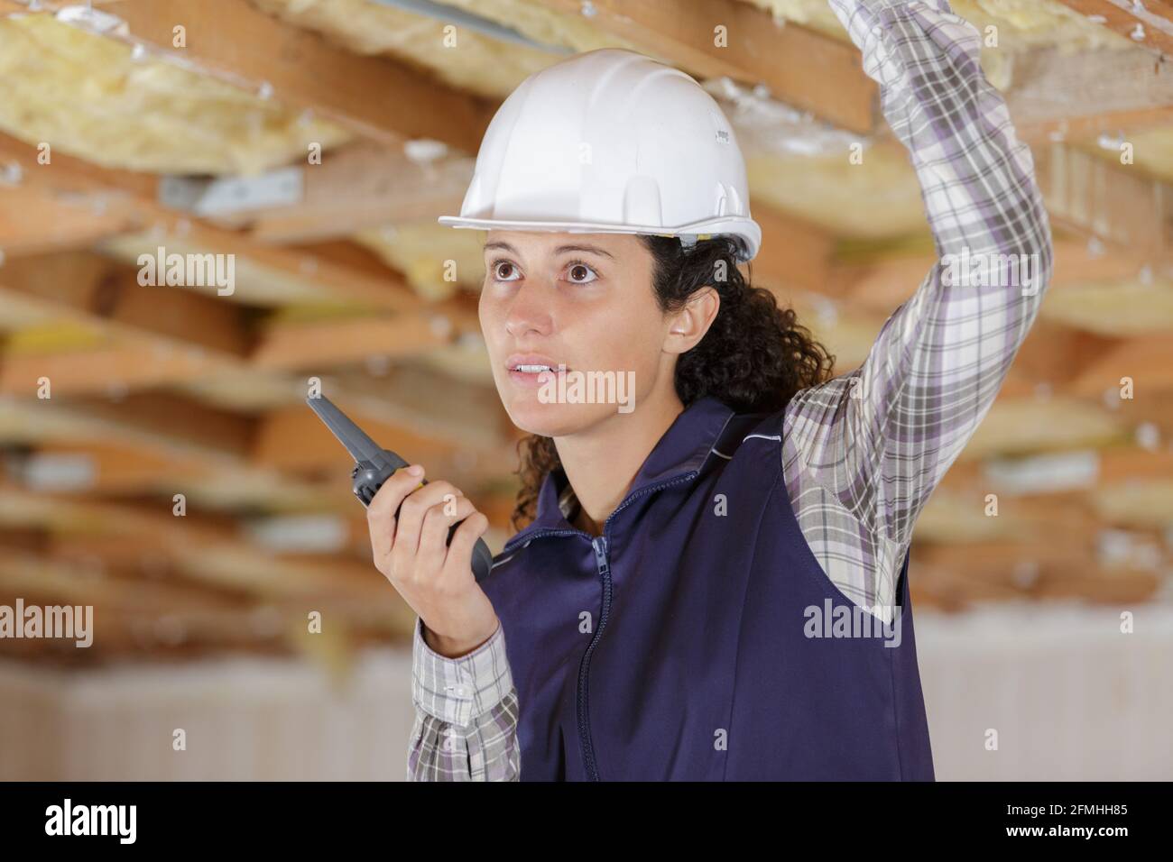 female foreman with a walkie-talkie Stock Photo - Alamy