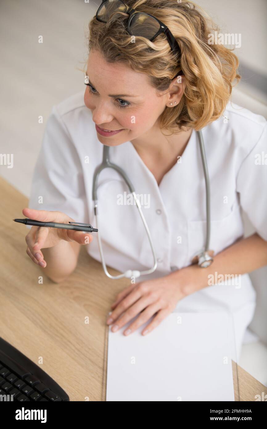 overhead picture of nurse talking Stock Photo - Alamy