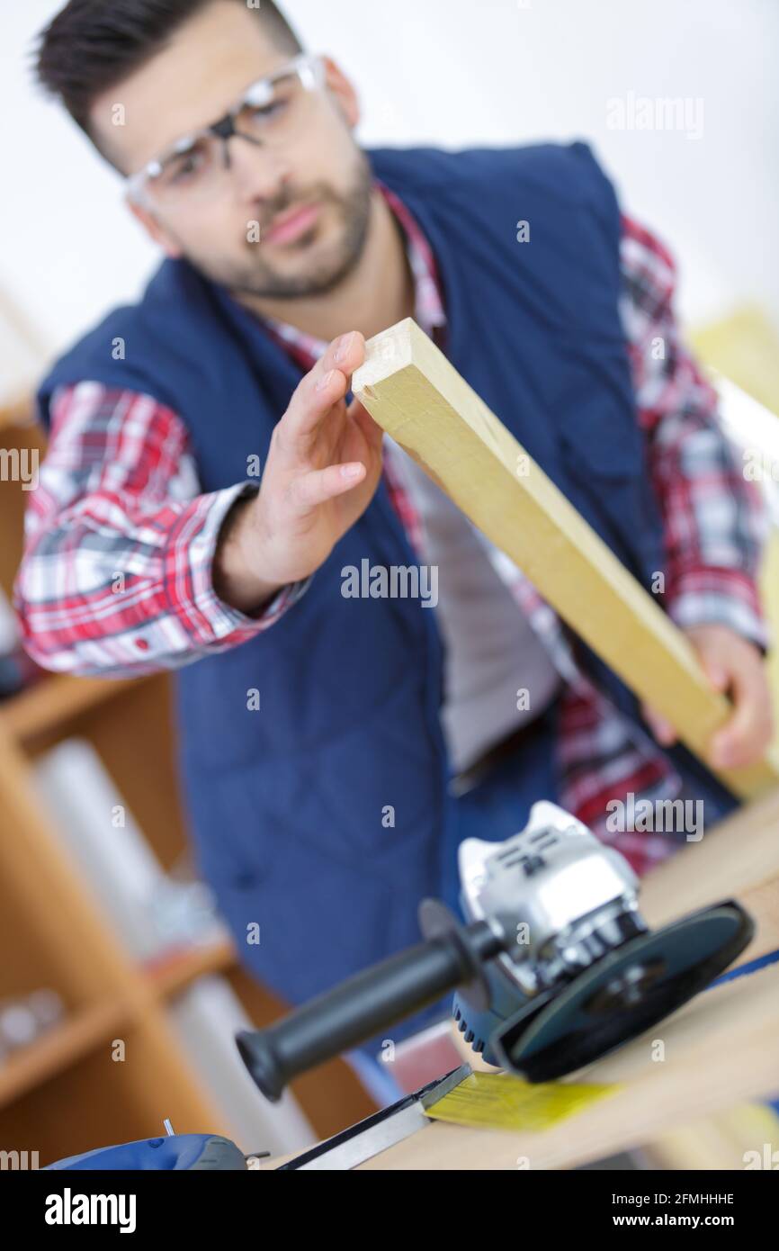 man wood brashing with drill machine Stock Photo - Alamy