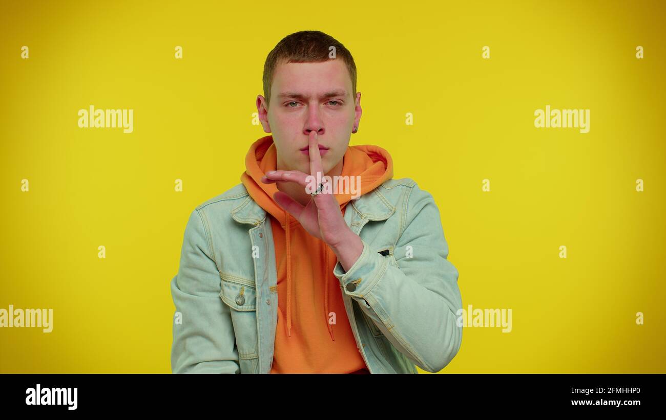 Teenager boy gesture shh hi-res stock photography and images - Alamy