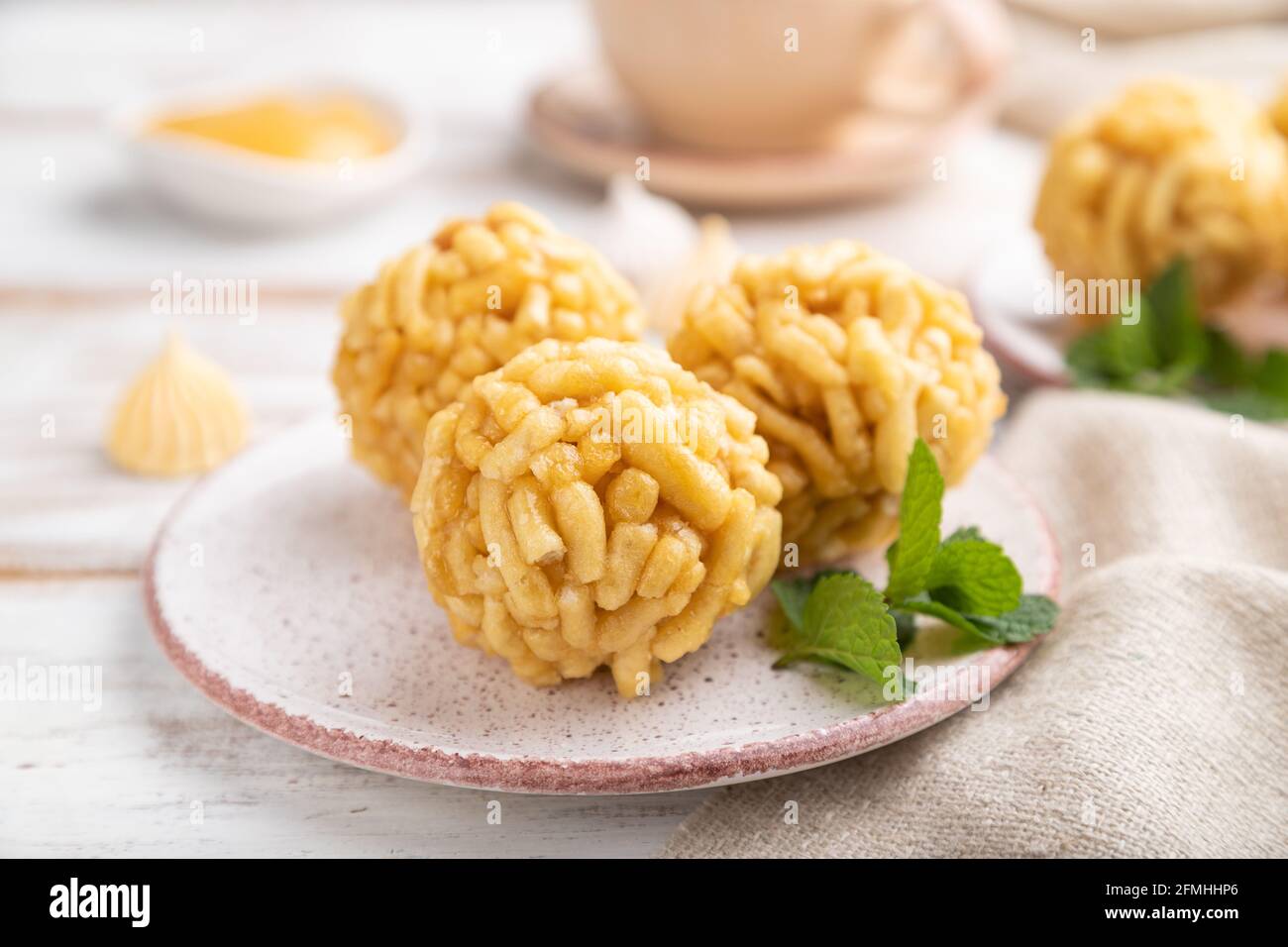 Traditional Tatar candy chak-chak made of dough and honey with cup of ...