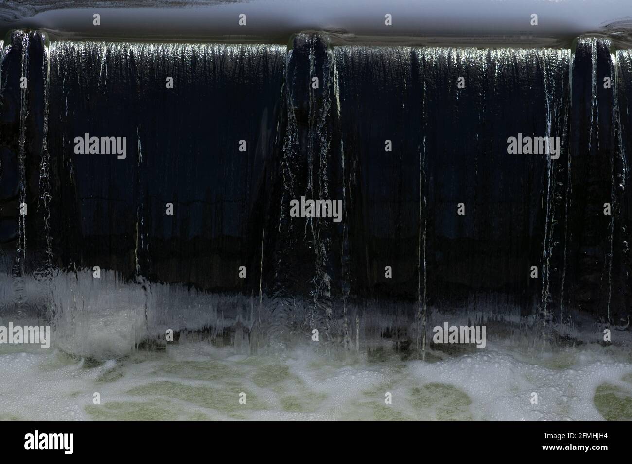 A closeup of a stream over a dam in a park in the daylight Stock Photo ...