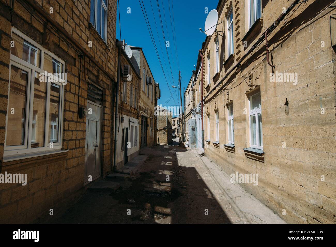 Old houses on low-rise street in old part of Derbent city in Russia ...