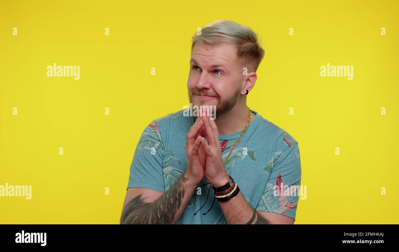 Sneaky cunning man with tricky face scheming evil plan, thinking over ...