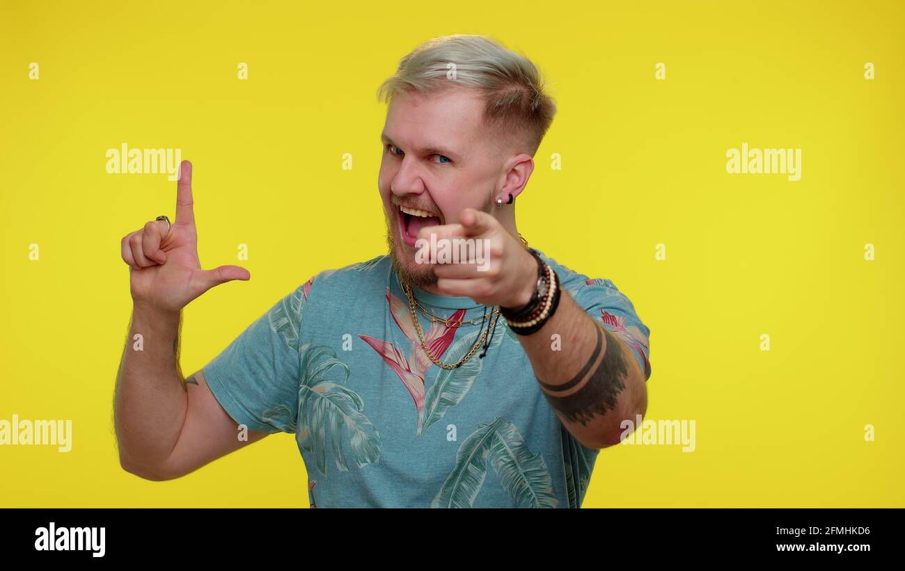 Man tourist showing loser gesture and pointing on you, blaming accusing ...