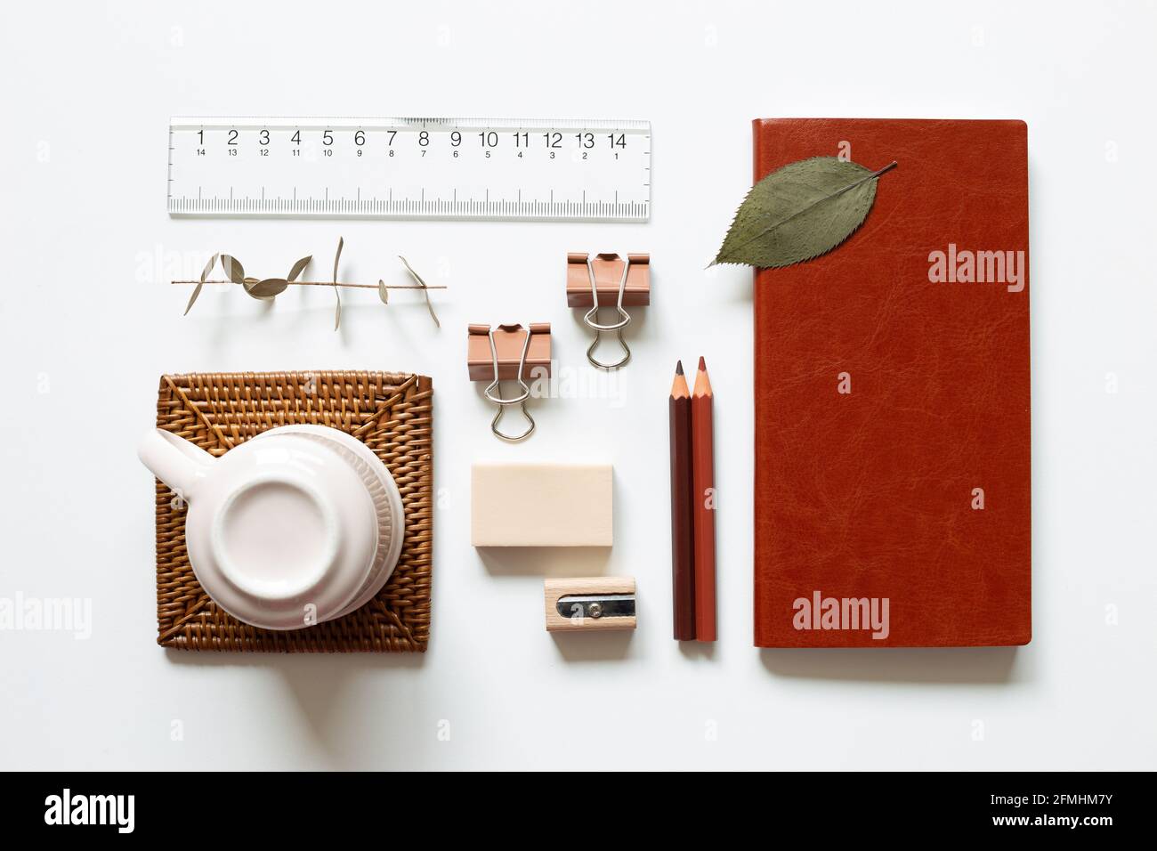 Office desk. Notebook, colored pencel, pencil sharpener, eraser, clip ...