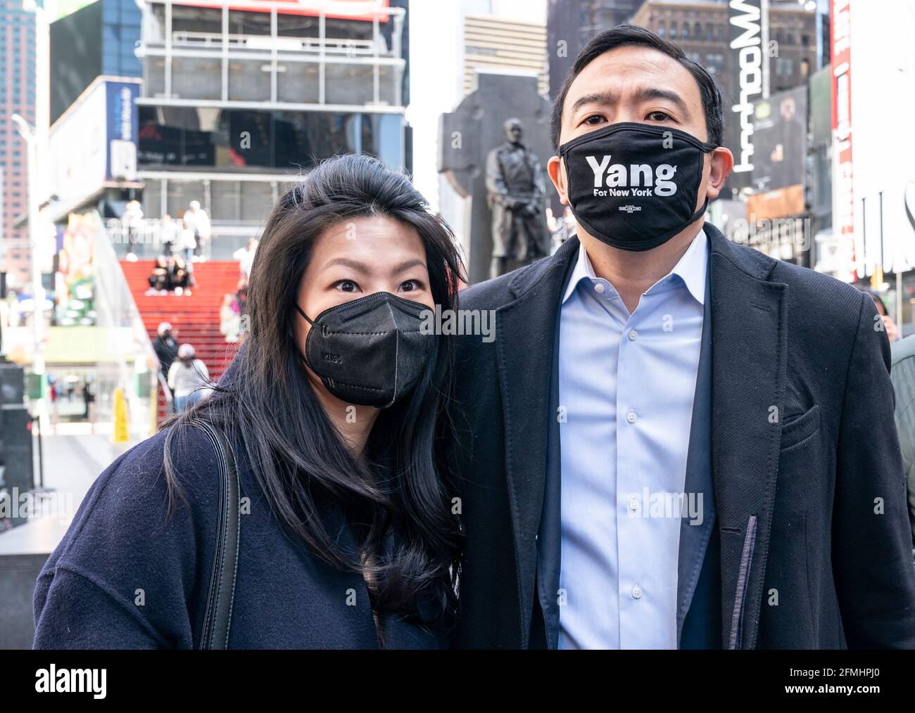 Mayoral candidate Andrew Yang with wife Evelyn Yang holds a press ...
