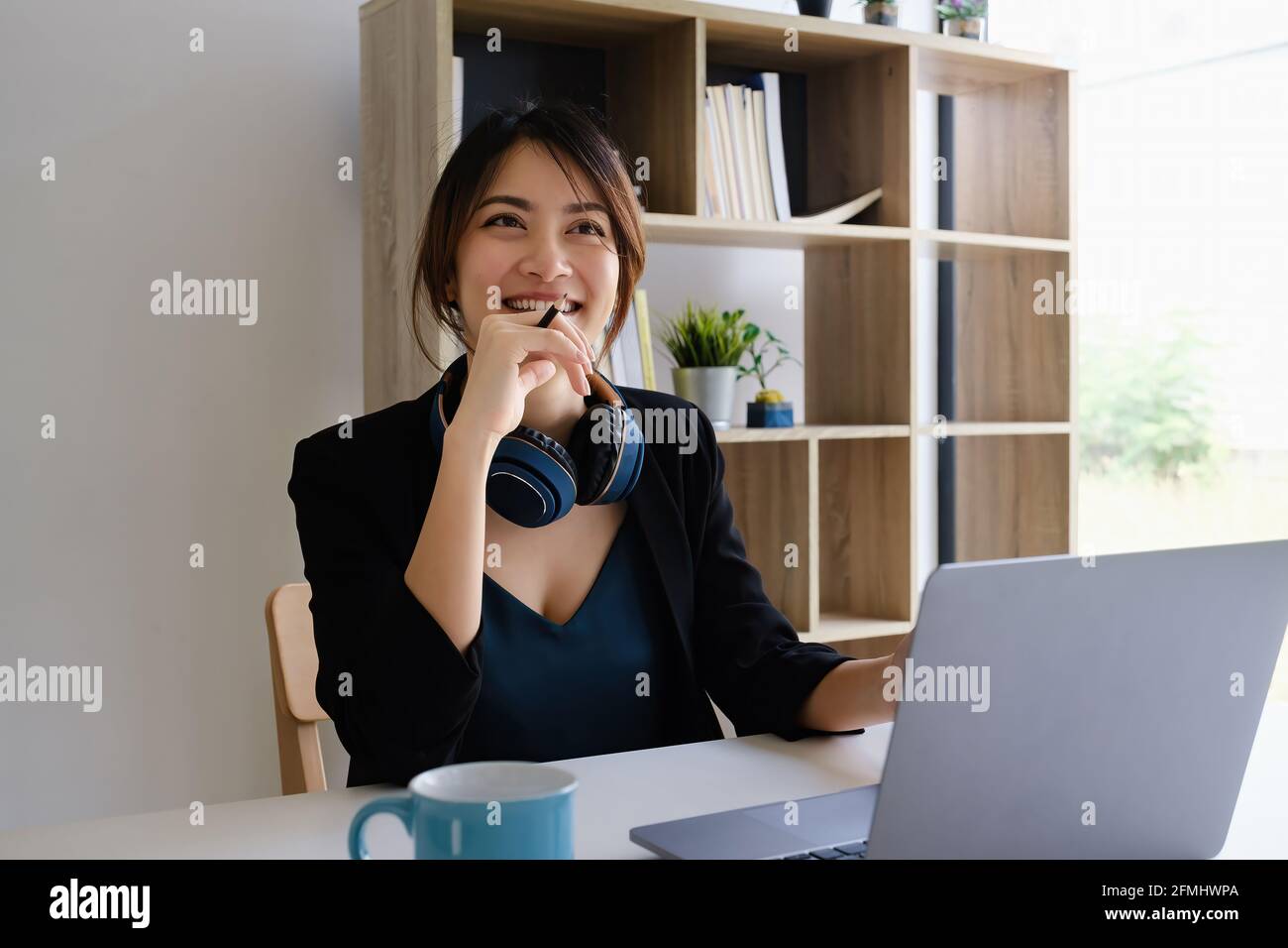 Female executive thinking over working schedule for employee writing ...