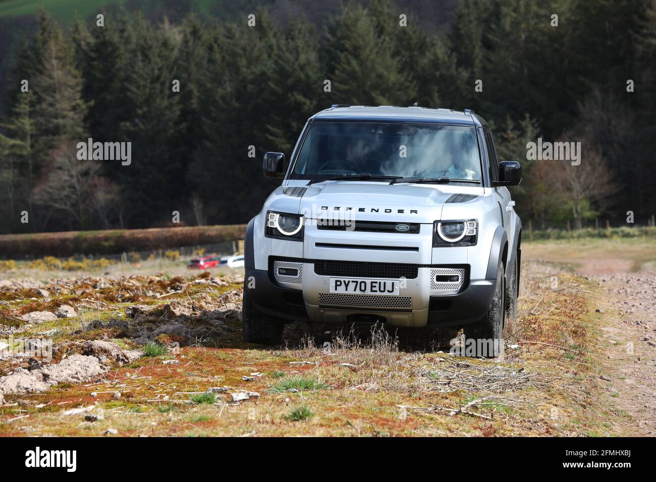 A new Land Rover Defender pictured driving over land in Scotland, UK ...