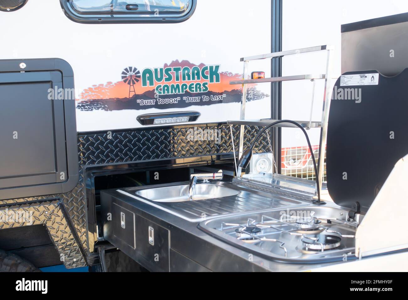 Kitchen slides out of small camper van Stock Photo - Alamy