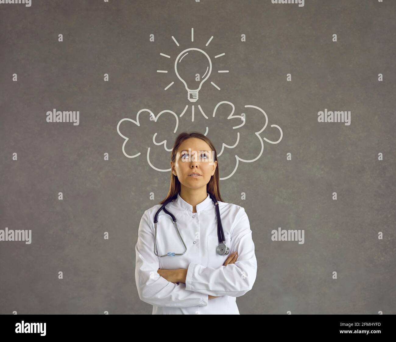 Doctor with light bulb shaped rocket above head thinking of innovative ...