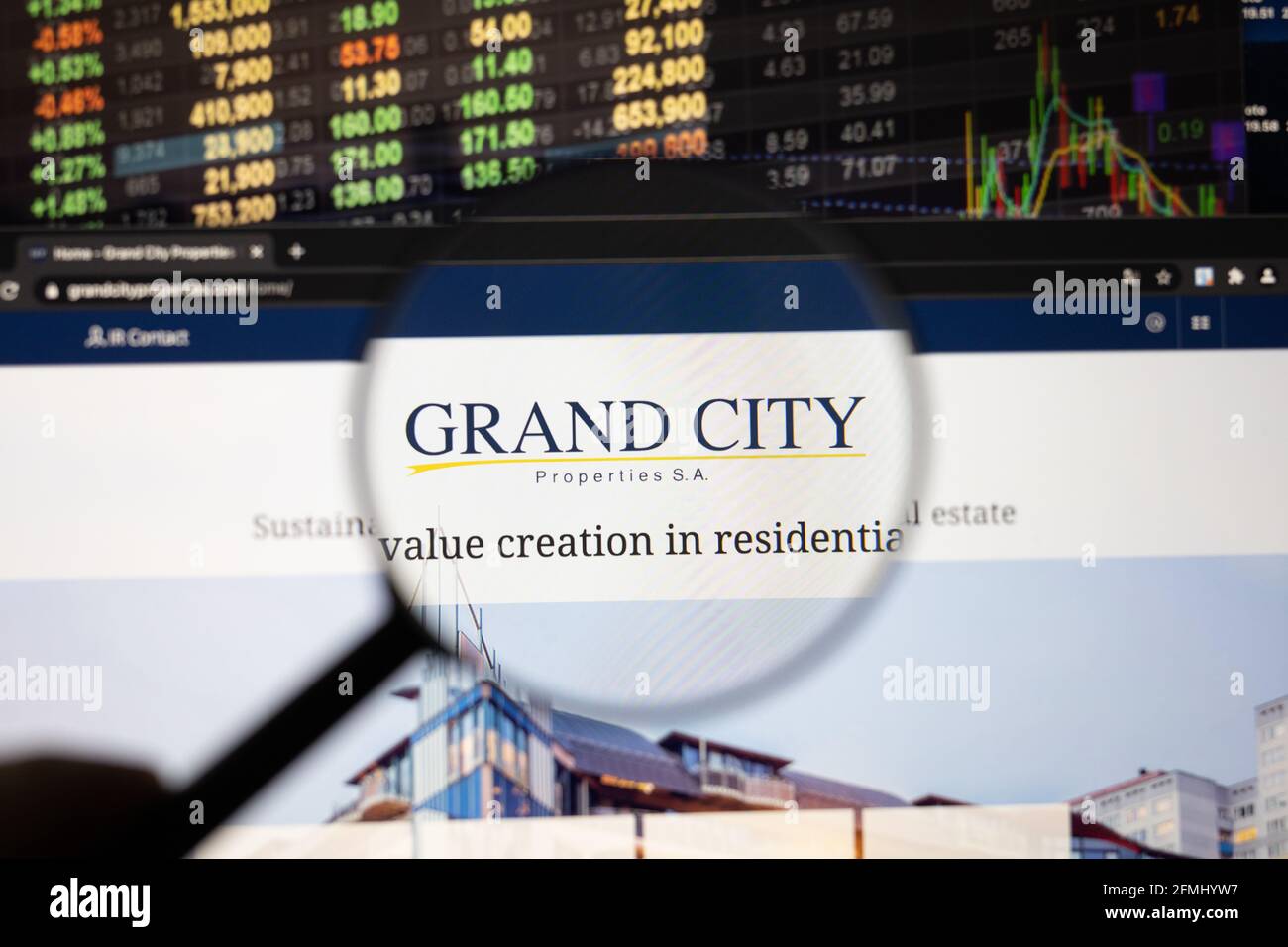 Grand City Properties company logo on a website with blurry stock ...