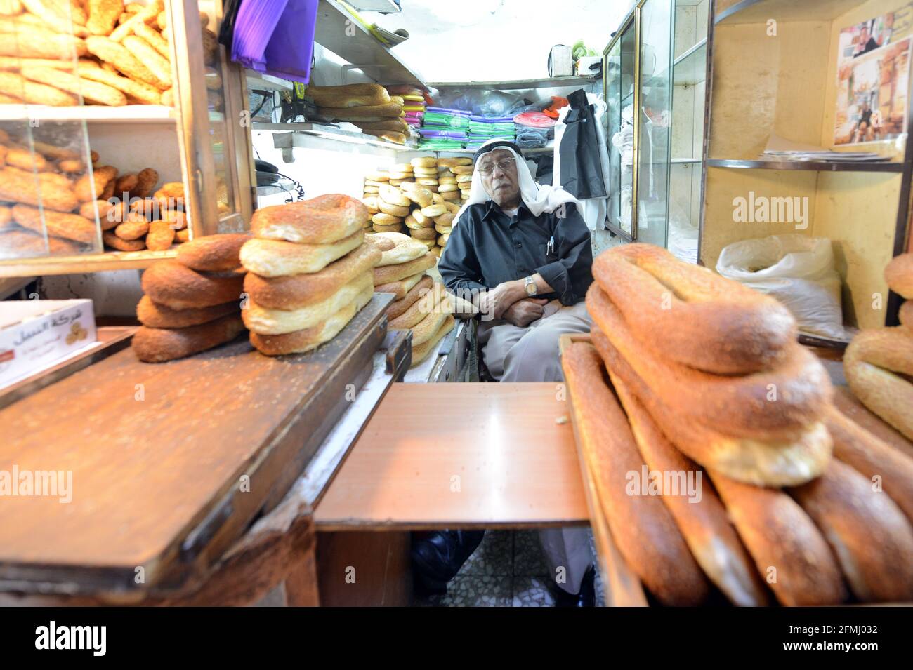 A Palestinian man selling Ka'ak bread from his little shop in the ...