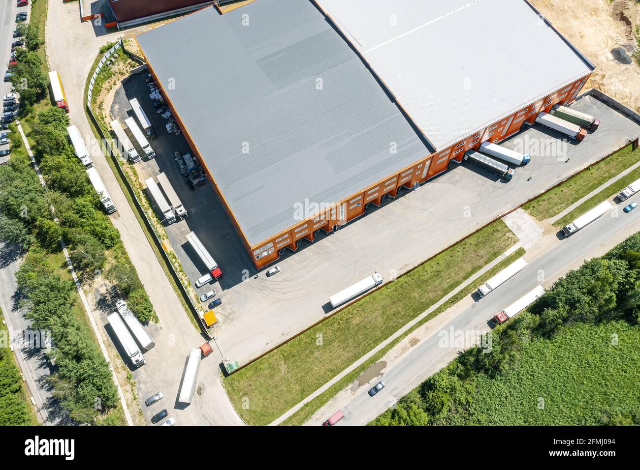 cargo trucks in industrial warehouse or logistic center waiting for ...