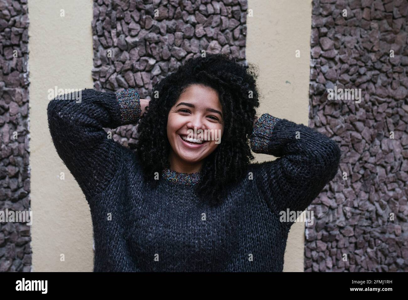 Thoughtful female wearing elegant clothes standing sunlight on shabby ...