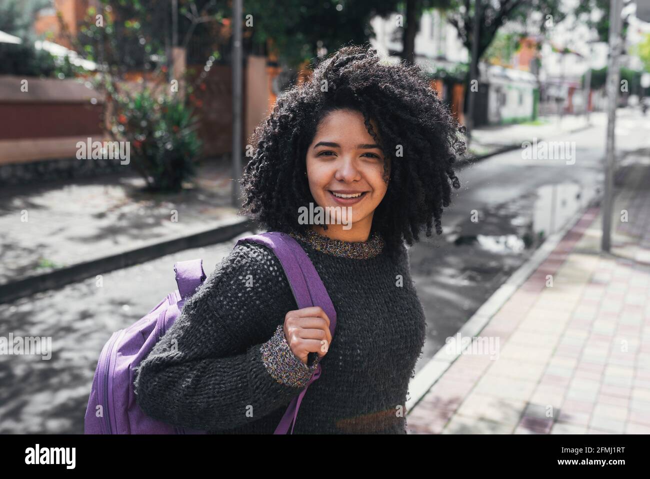 Low angle side view of peaceful African American male with Afro hair ...