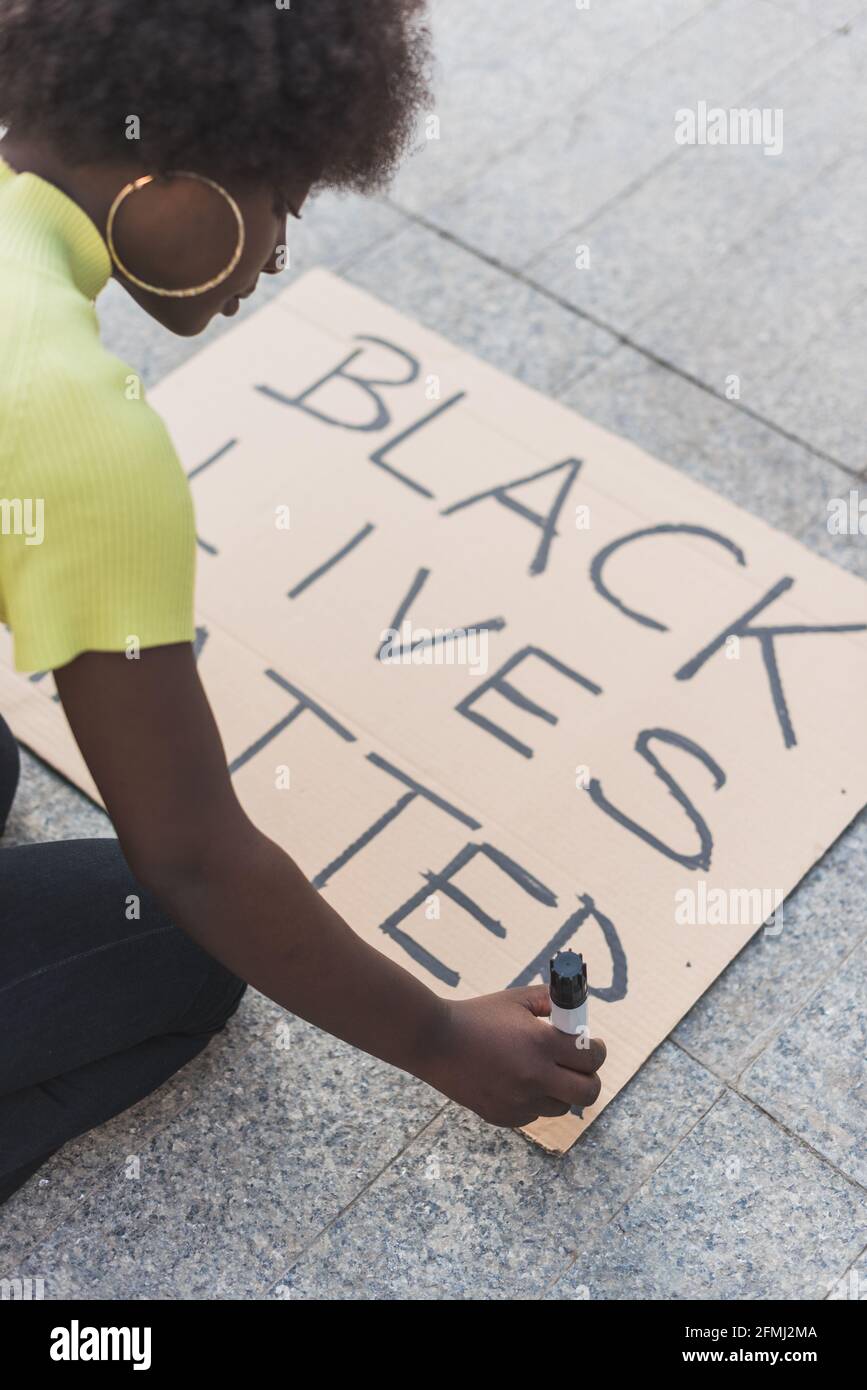 Female blm activist with placard hi-res stock photography and images ...