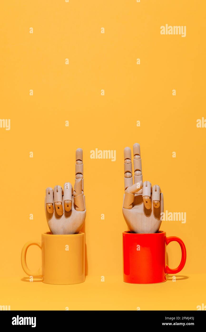 Creative ornamental wooden hand with index and middle finger together ...