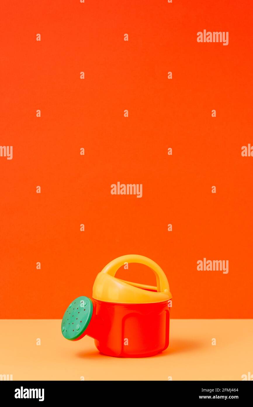 Colorful illustration representing plastic toy watering cans with ...