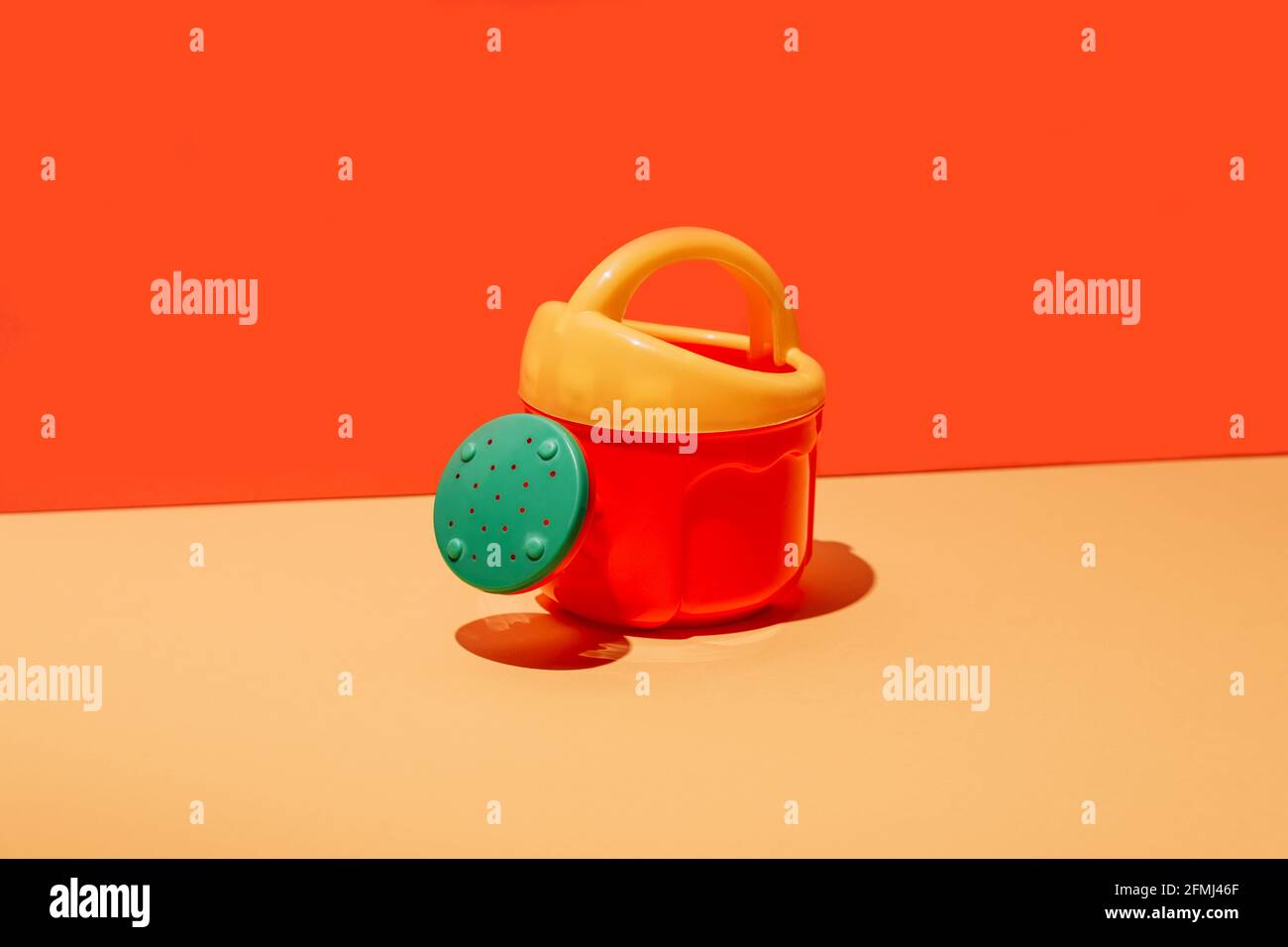 Colorful illustration representing plastic toy watering cans with ...