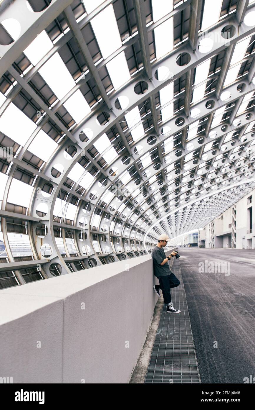 Side view faceless male photographer with professional photo camera ...