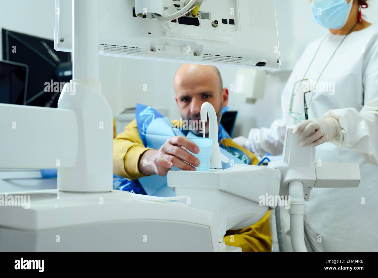 Doctor pouring water patient hi-res stock photography and images - Alamy