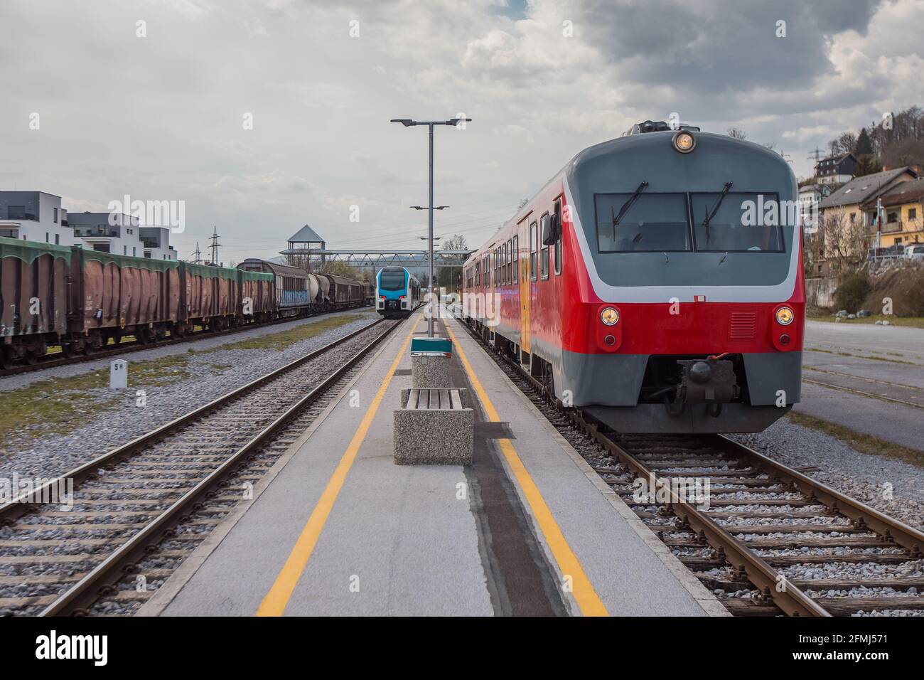 Old versus new passenger train standing on a platform. Concept of ...