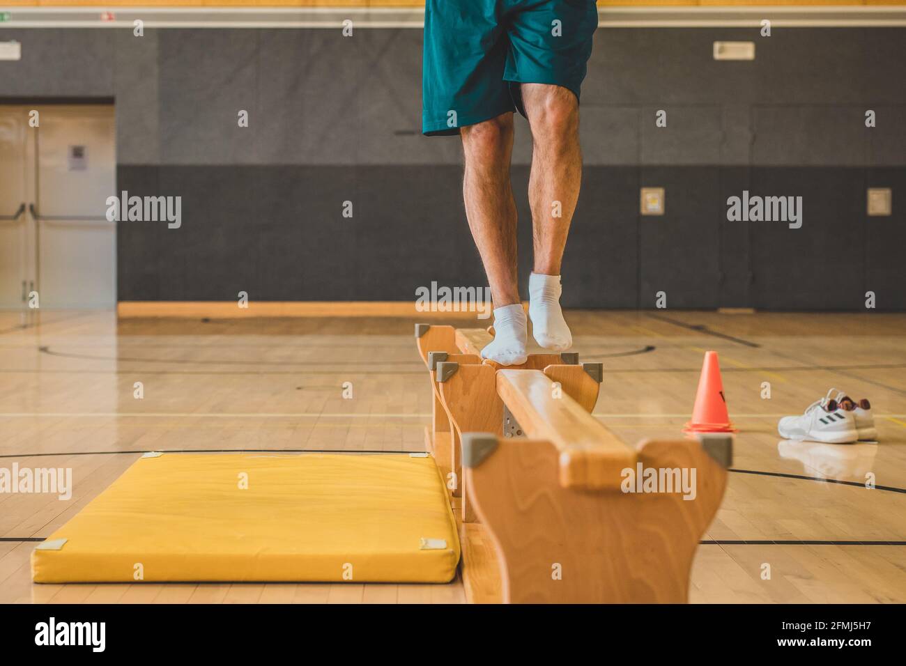 Male is training balance while walking on an upside down bench Stock ...