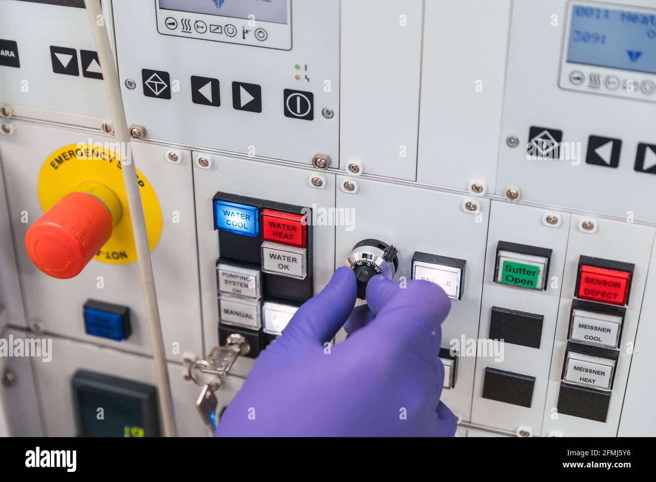 Crop unrecognizable professional male laboratory assistant in white ...