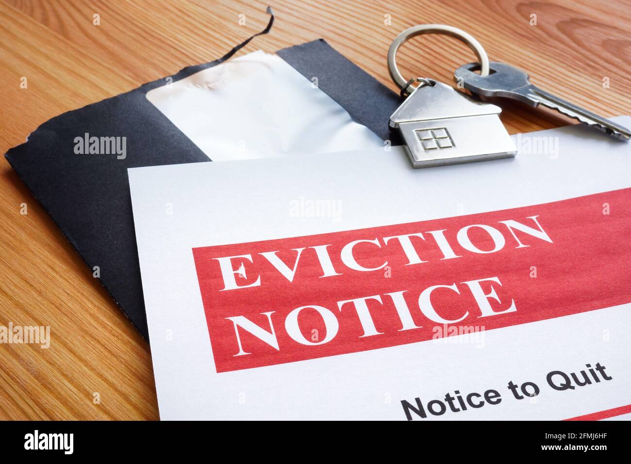 Open envelope and eviction notice to quit papers Stock Photo - Alamy