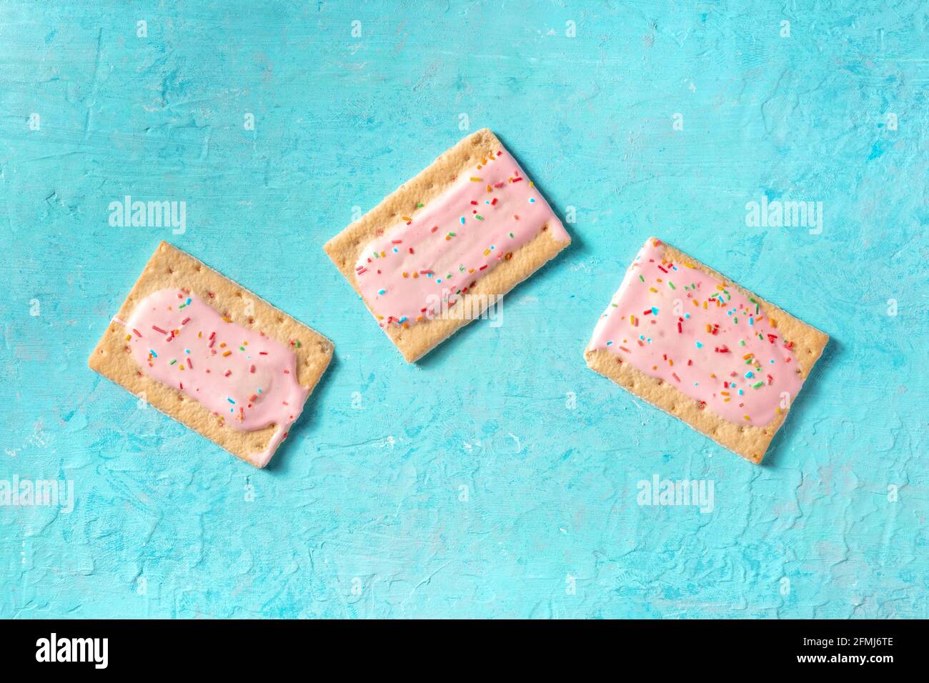 Pop tarts, overhead flat lay shot on a blue background Stock Photo - Alamy