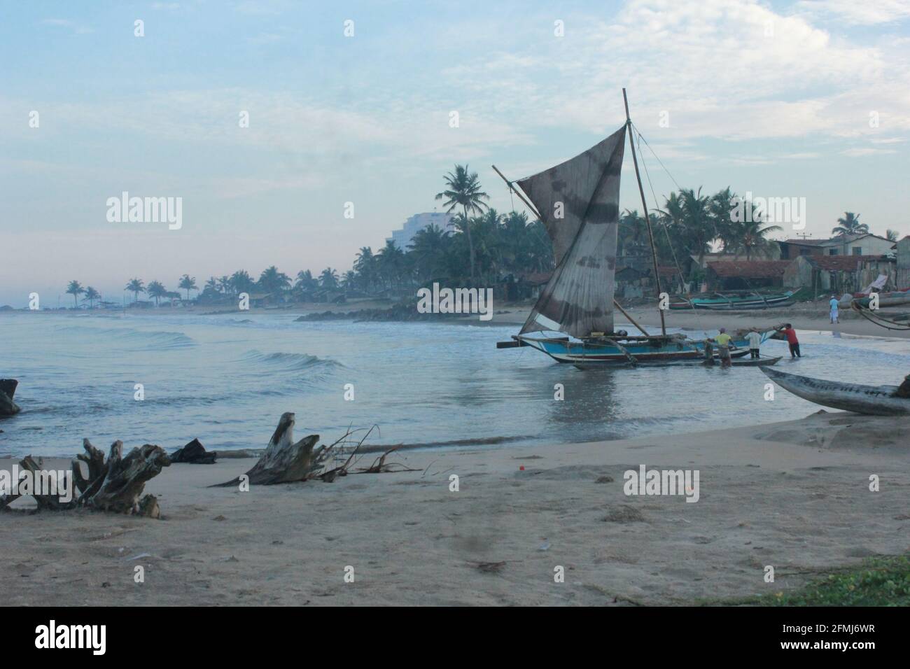 Fisherman sailing in wind boat Stock Photo - Alamy