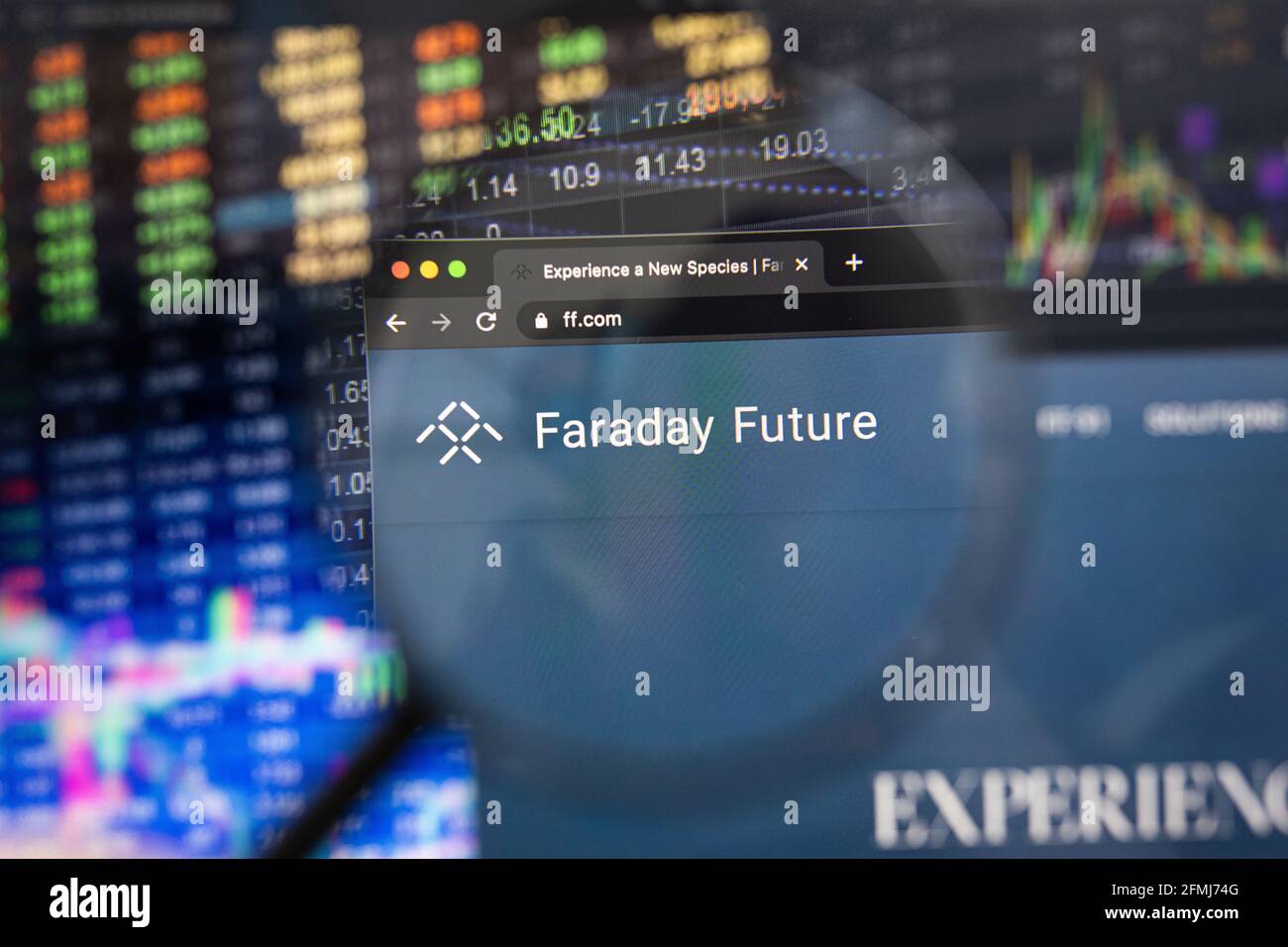 Faraday Future company logo on a website with blurry stock market ...