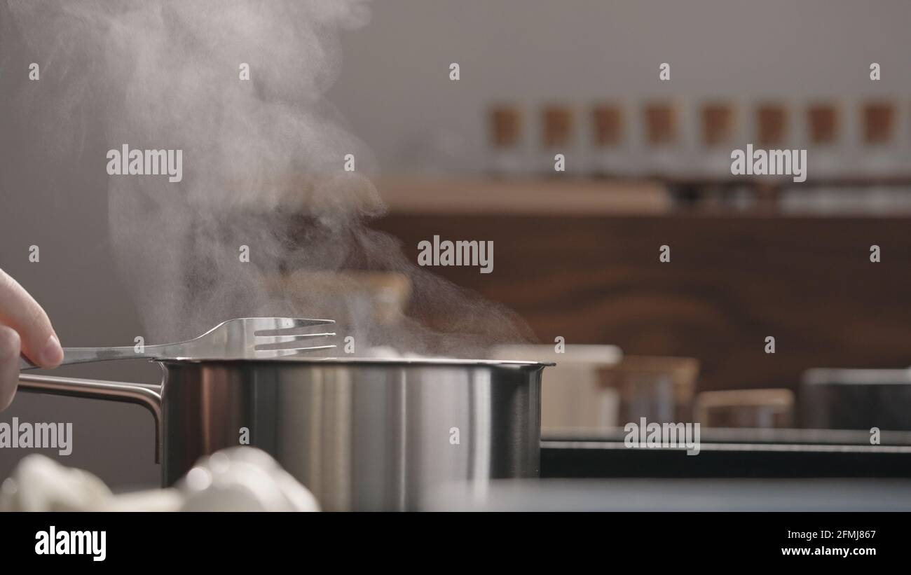 Steam rising from boiling pot hi-res stock photography and images - Alamy