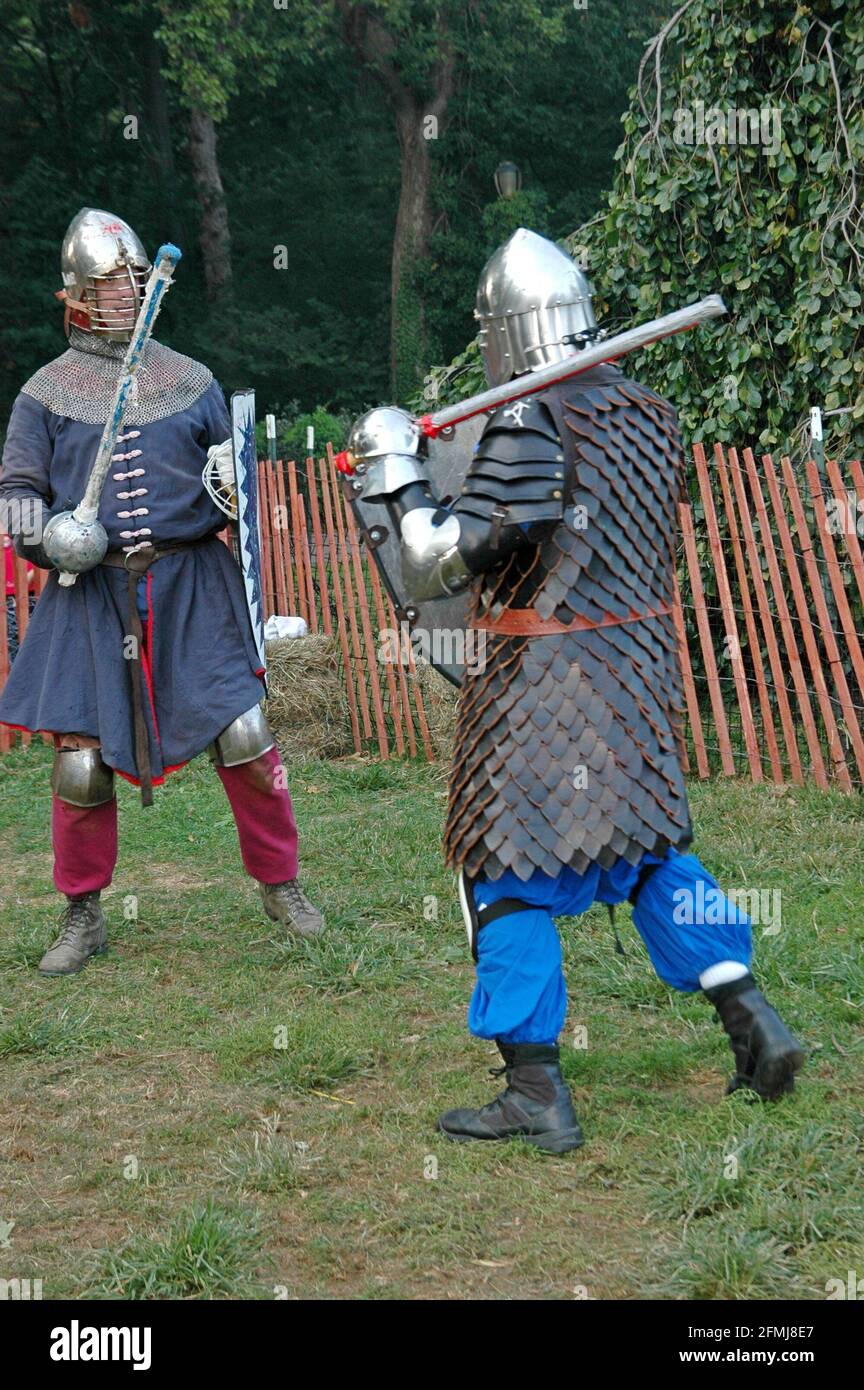 Re-enactors in medieval costume take part in a medieval tournament at ...