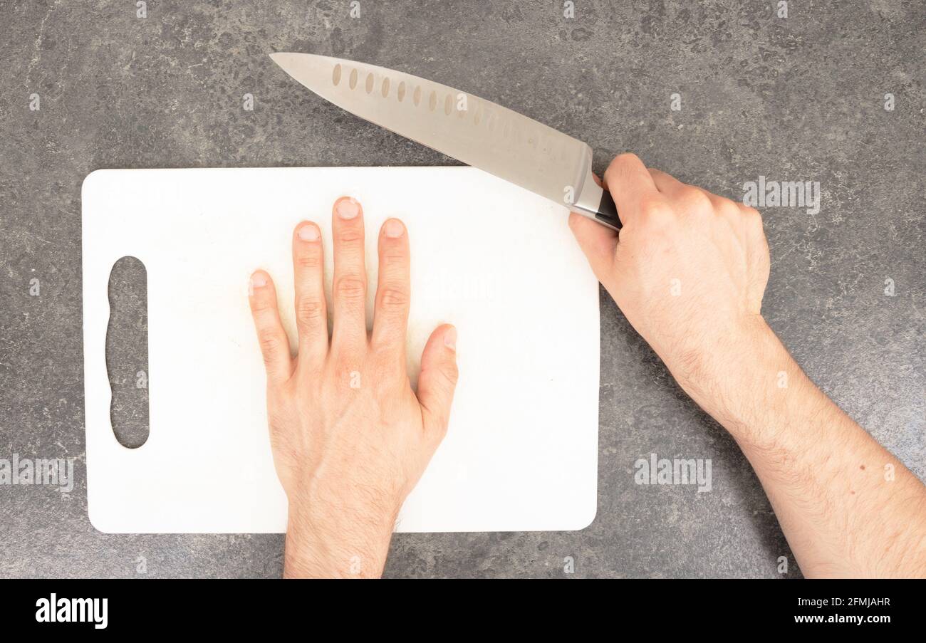Cutting the fingers with knife - Preparation - Isolated on white Stock ...