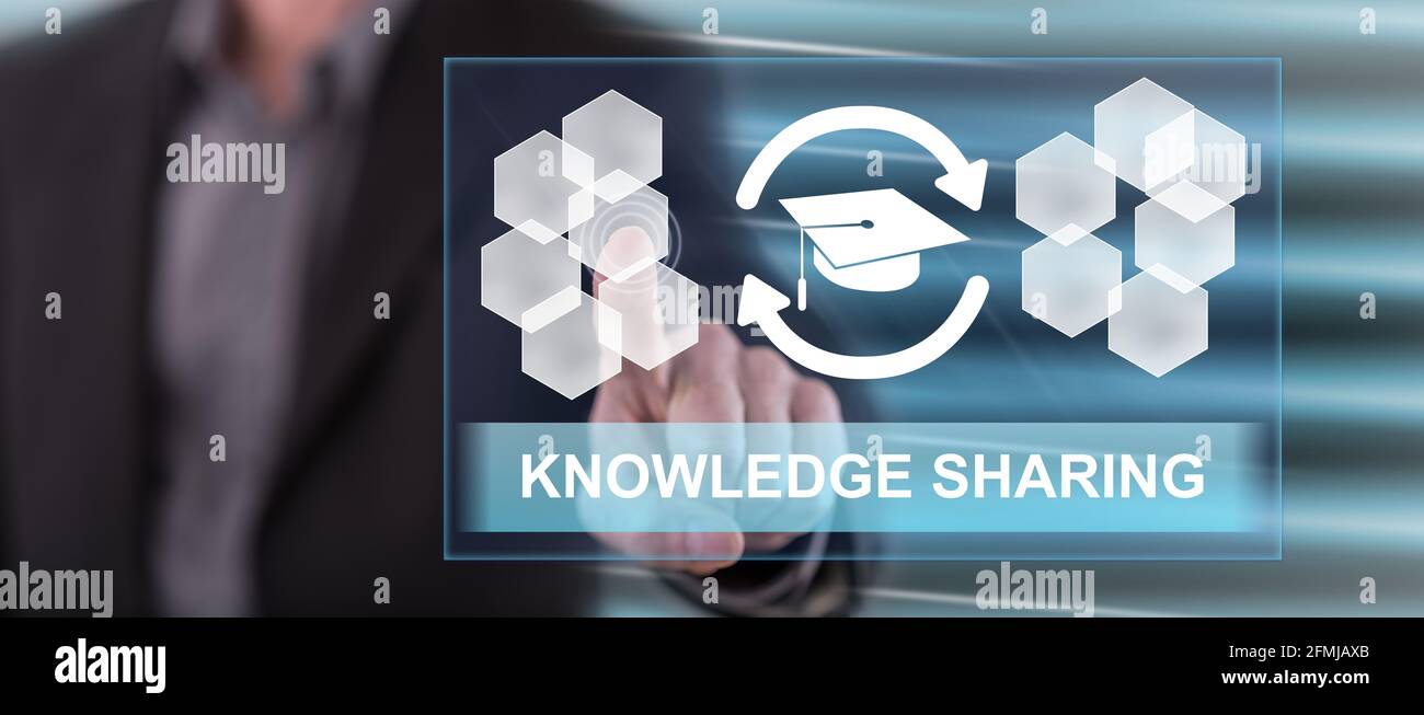 Man touching a knowledge sharing concept on a touch screen with his ...